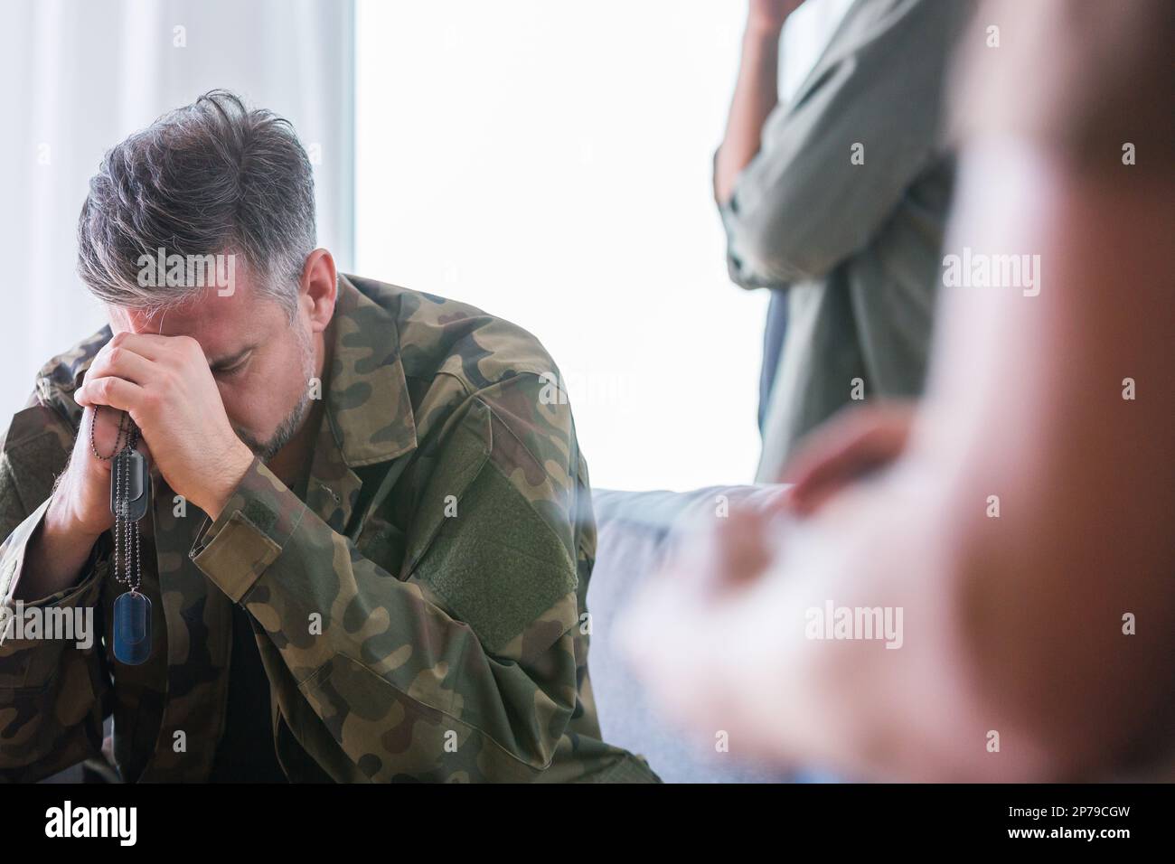 Middle aged man crying on therapy treating his trauma Stock Photo - Alamy