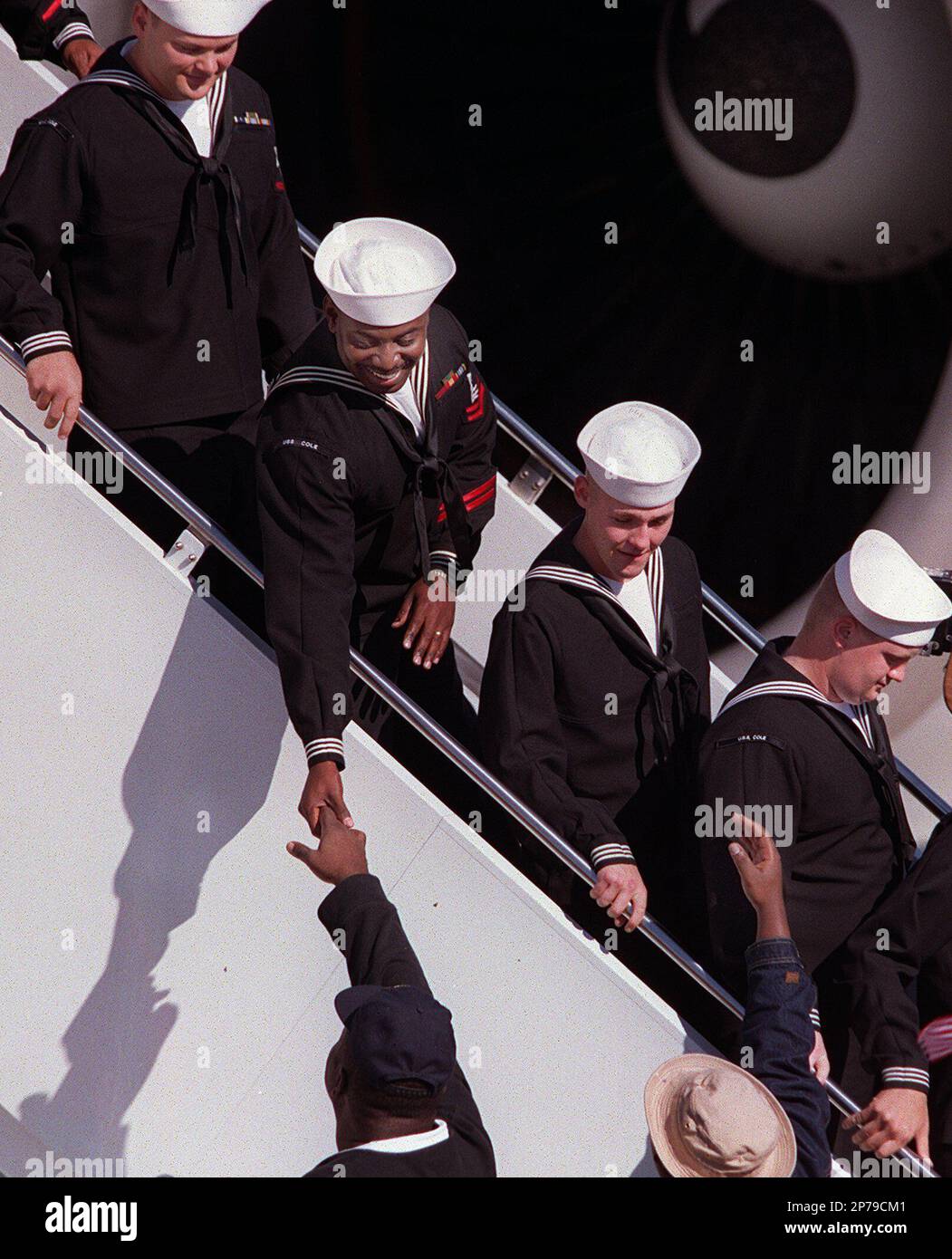Crew members of the USS Cole were welcomed back to Norfolk, VA Friday ...