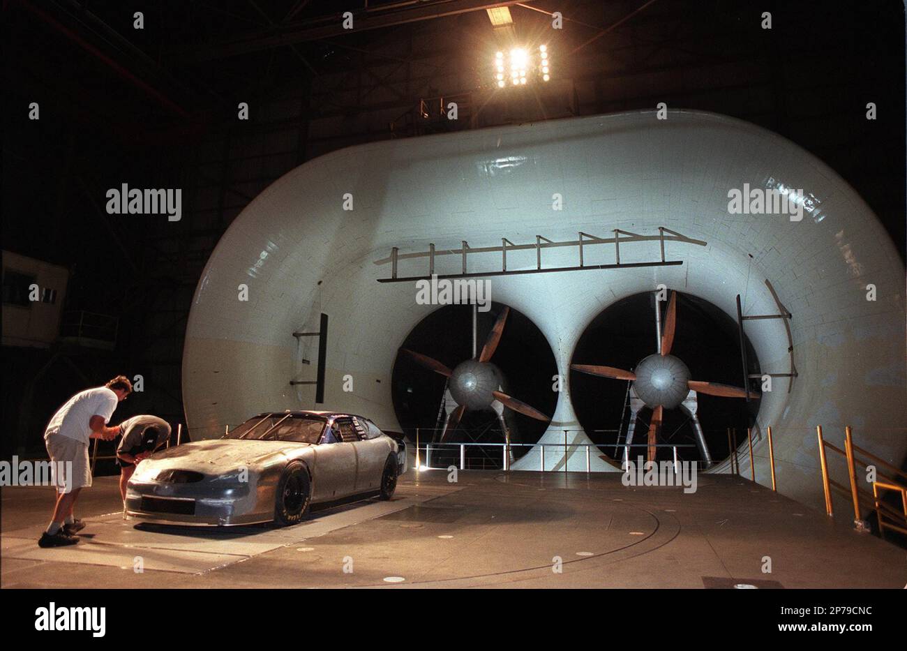Racing crew works over a mock-up of a NASCAR driver's Rusty Wallace ...