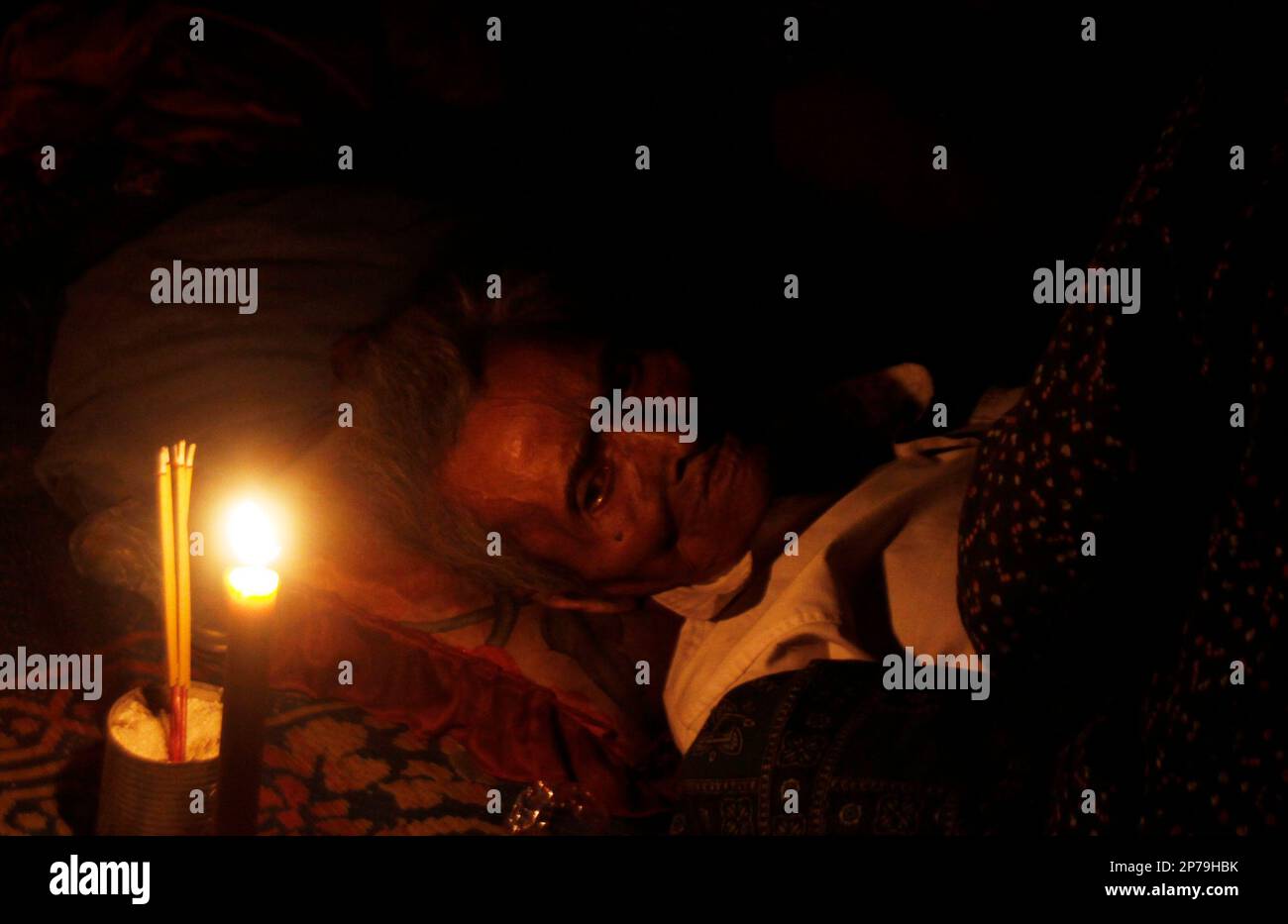 A Cambodian refugee lies down to sleep in a tent at a refugee camp at ...