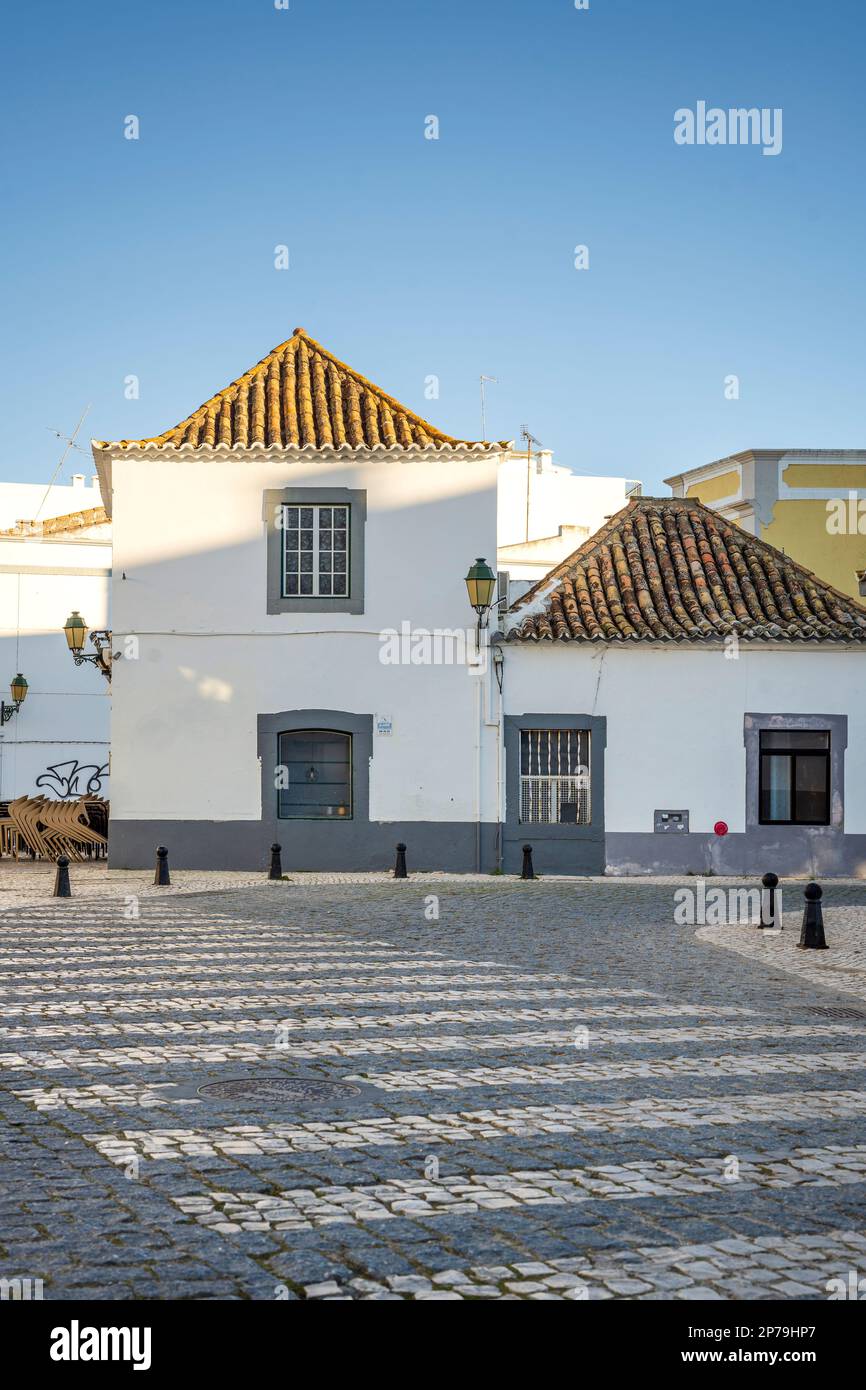 Historic street in Faro with traditional Portuguese architecture ...