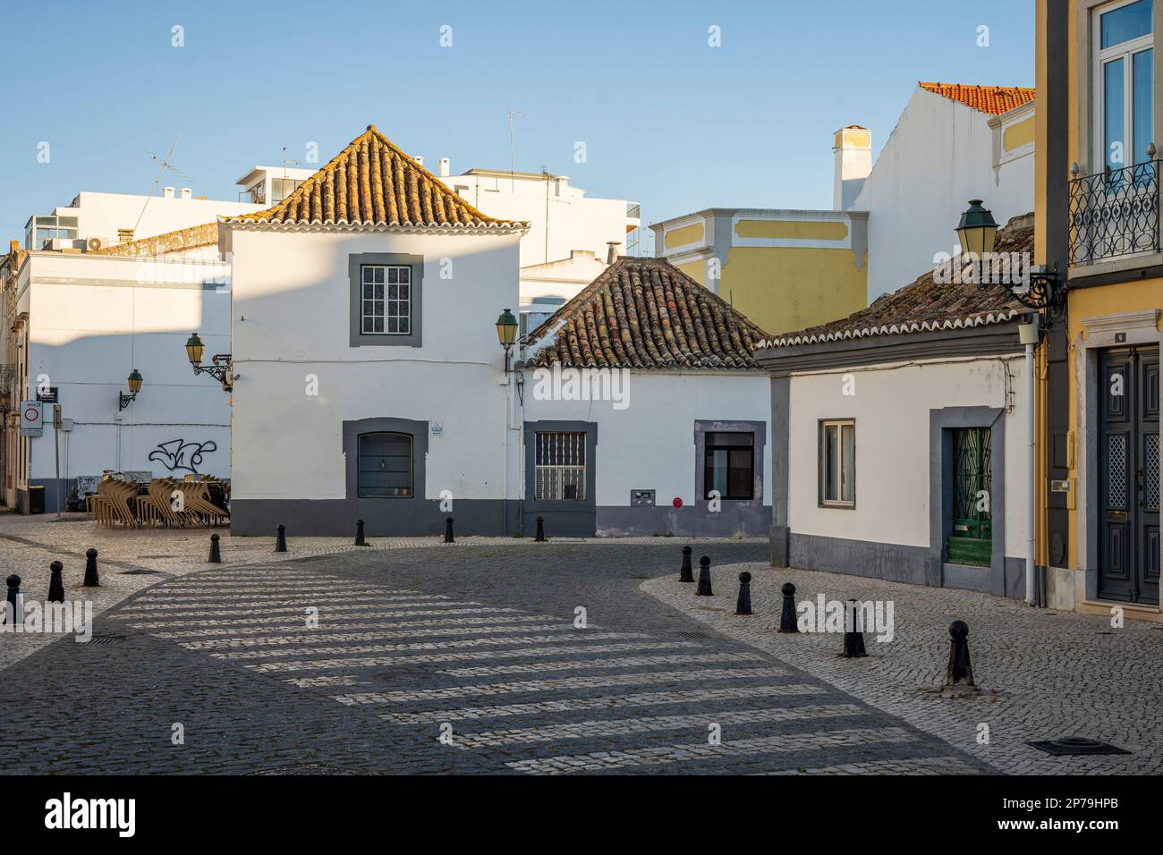 Historic street in Faro with traditional Portuguese architecture ...