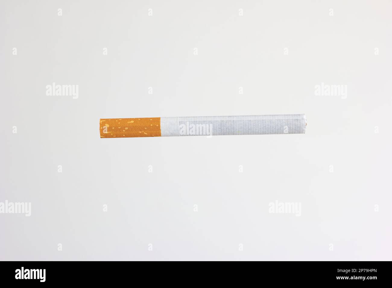 Single unlit cigarette stick with yellow filter studio close up shot ... Single unlit cigarette stick with yellow filter studio close up shot ...