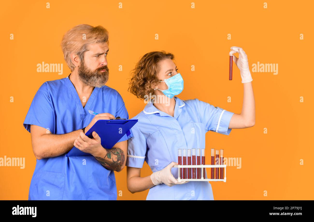 Medical couple testing tubes vaccination. Blood analysis. Good news ...