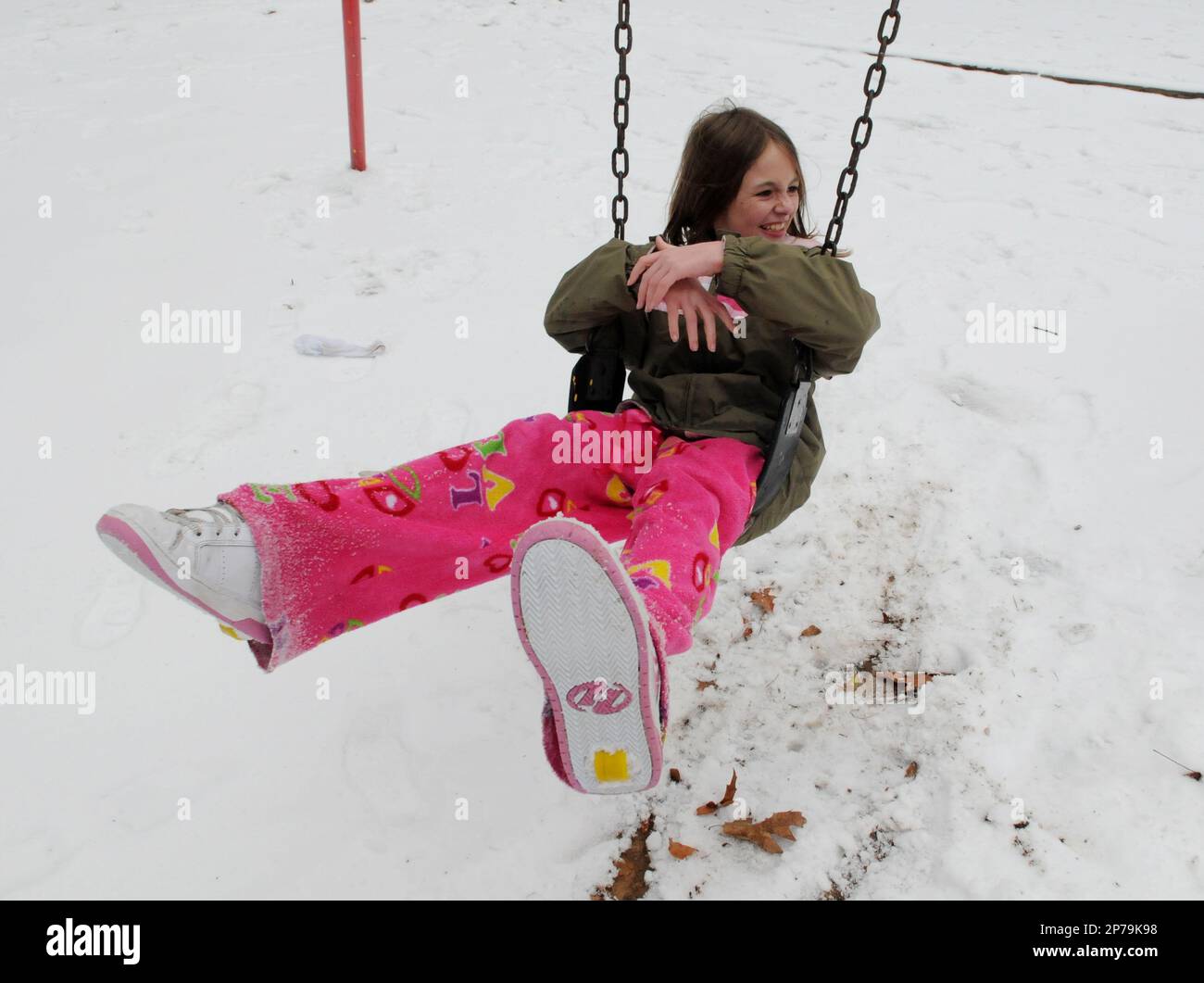 Ann Eliese Furr swings on a swing at Columbia Park in the snow, Friday ...