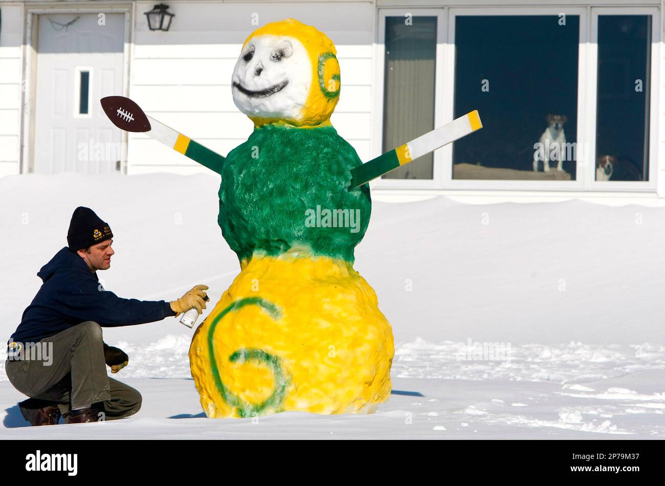Chad Guler shows his devotion to the Green Bay Packers by painting a ...
