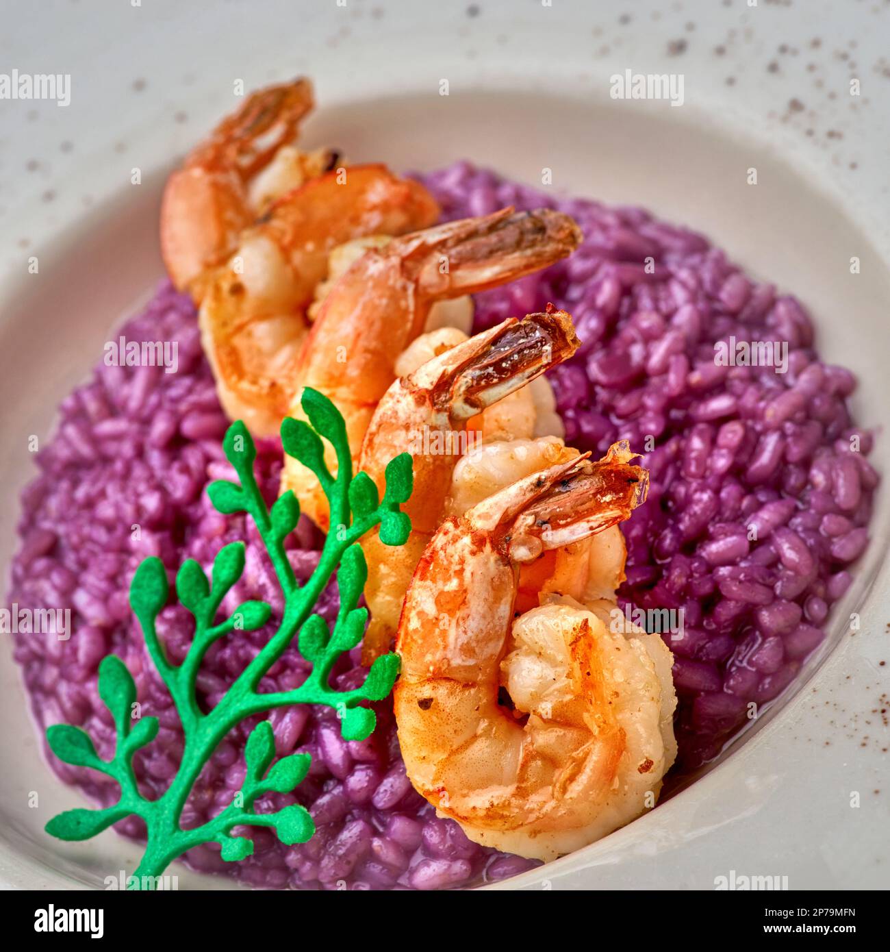 Delicious Italian risotto with grilled big tails of shrimp. Pink ...