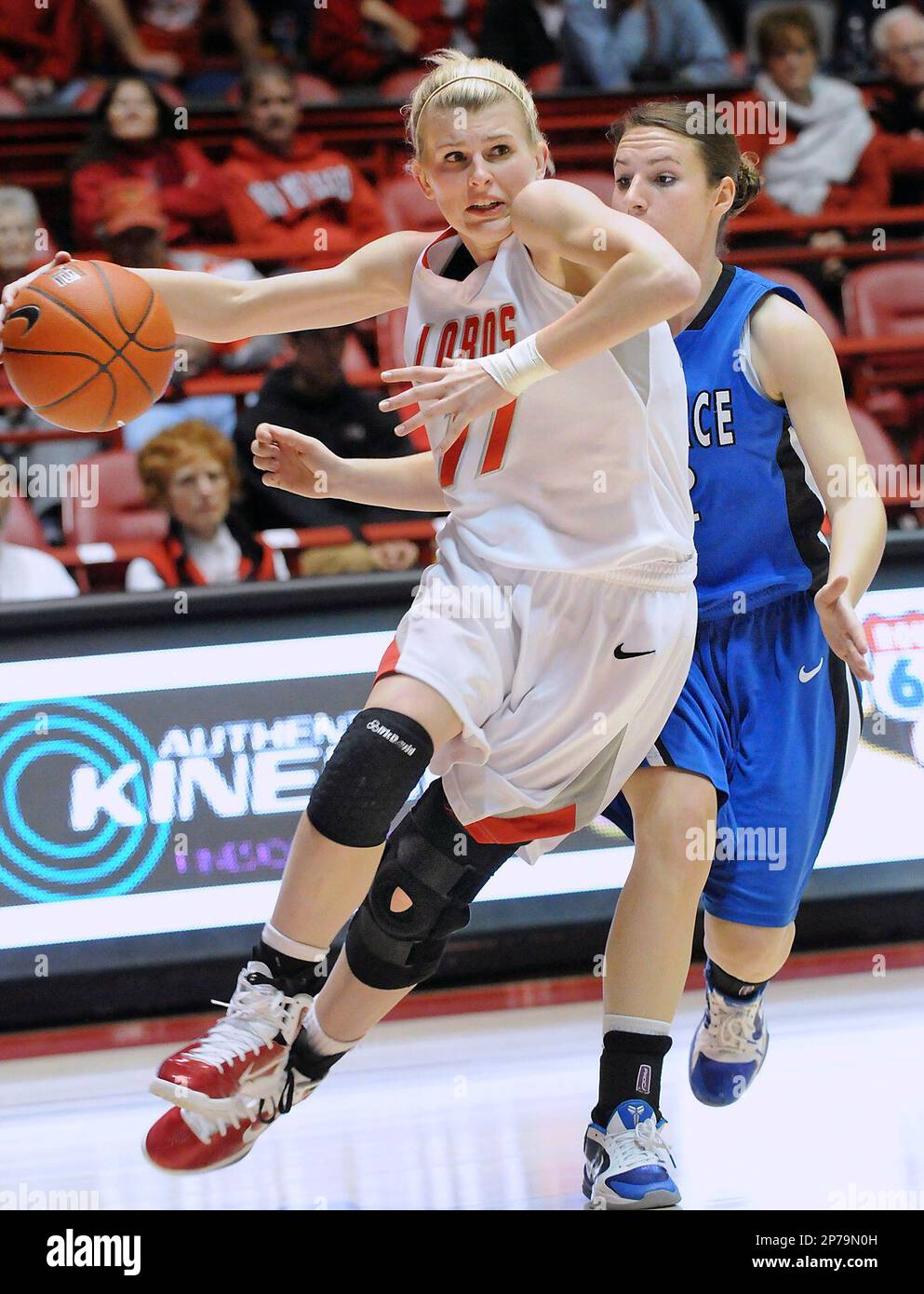 New Mexico's Lauren Taylor drives to the basket against Air Force's ...