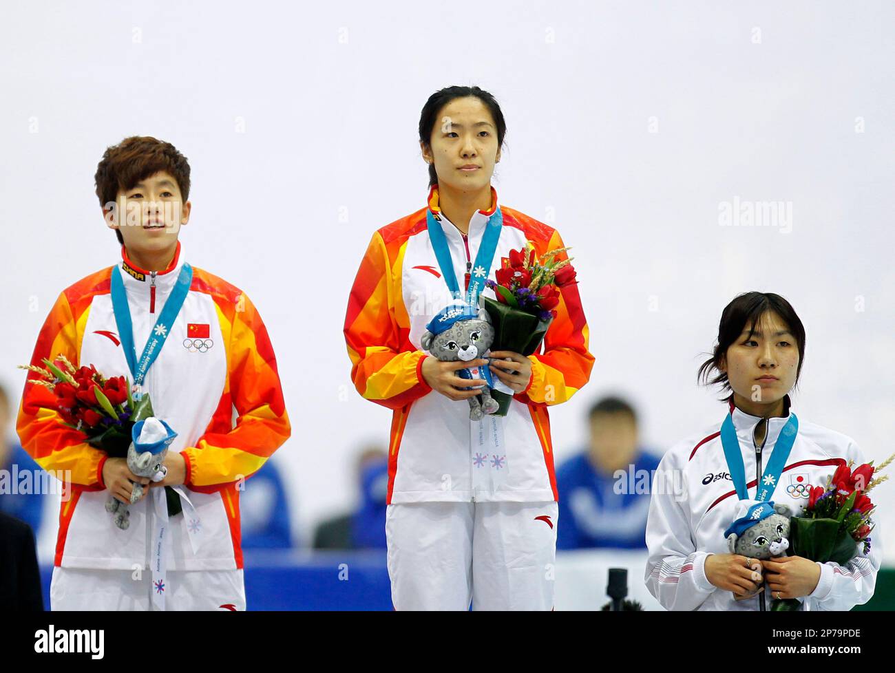 From left, China's Fan Kexin, Liu Qiuhong, and Japan's Sakai Yui pose with their silver, gold ...