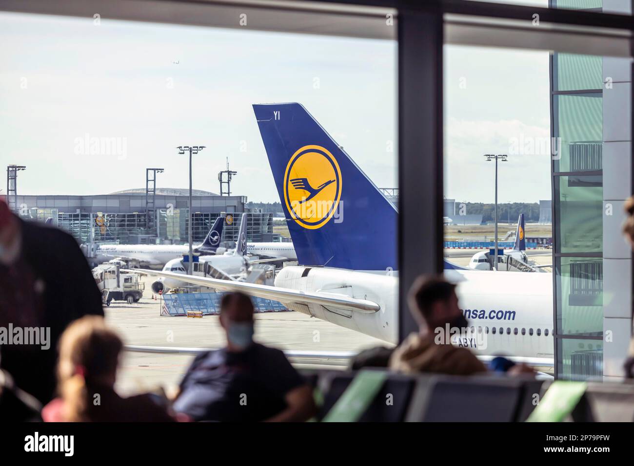 Fraport Airport, waiting area in the gate with passengers in front of a ...