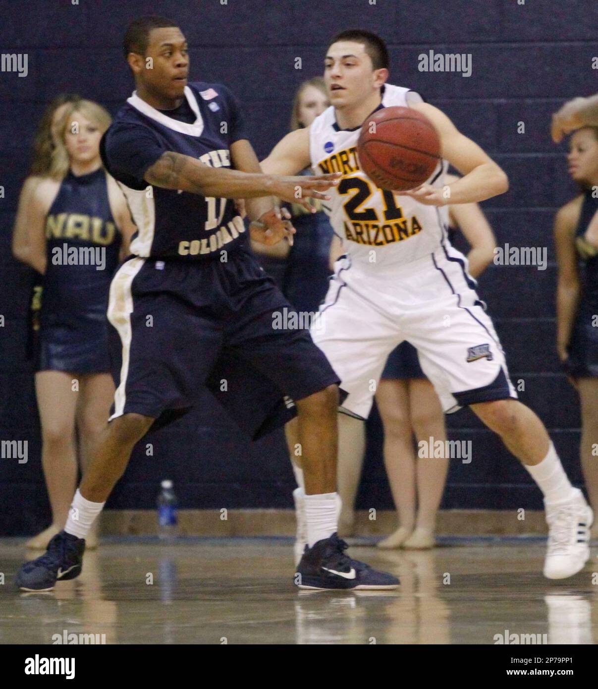 Northern Colorado's Elliott Lloyd, left, passes the ball away from ...