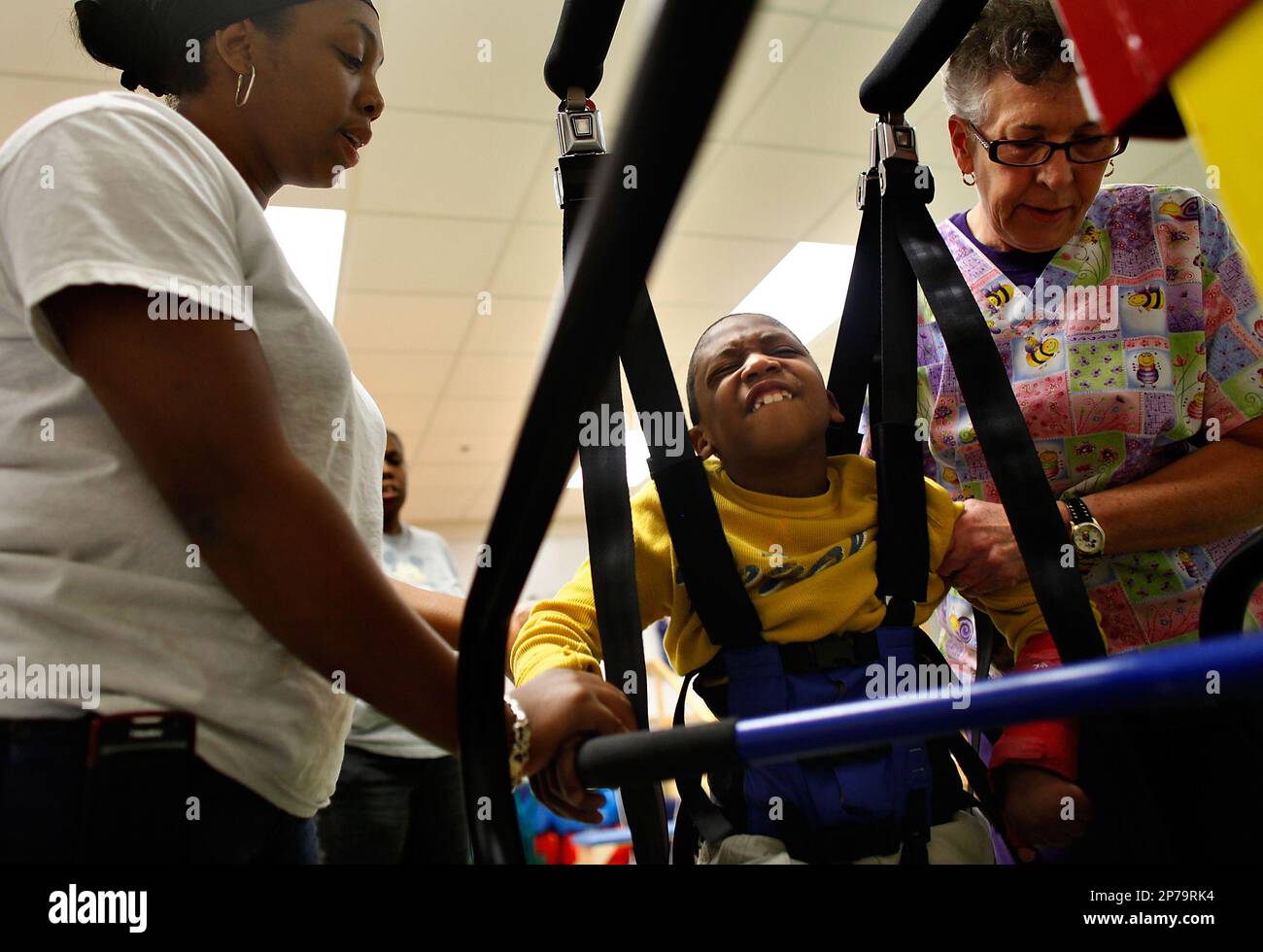Isaiah Jones, (cq) struggles to walk on the treadmill during his ...