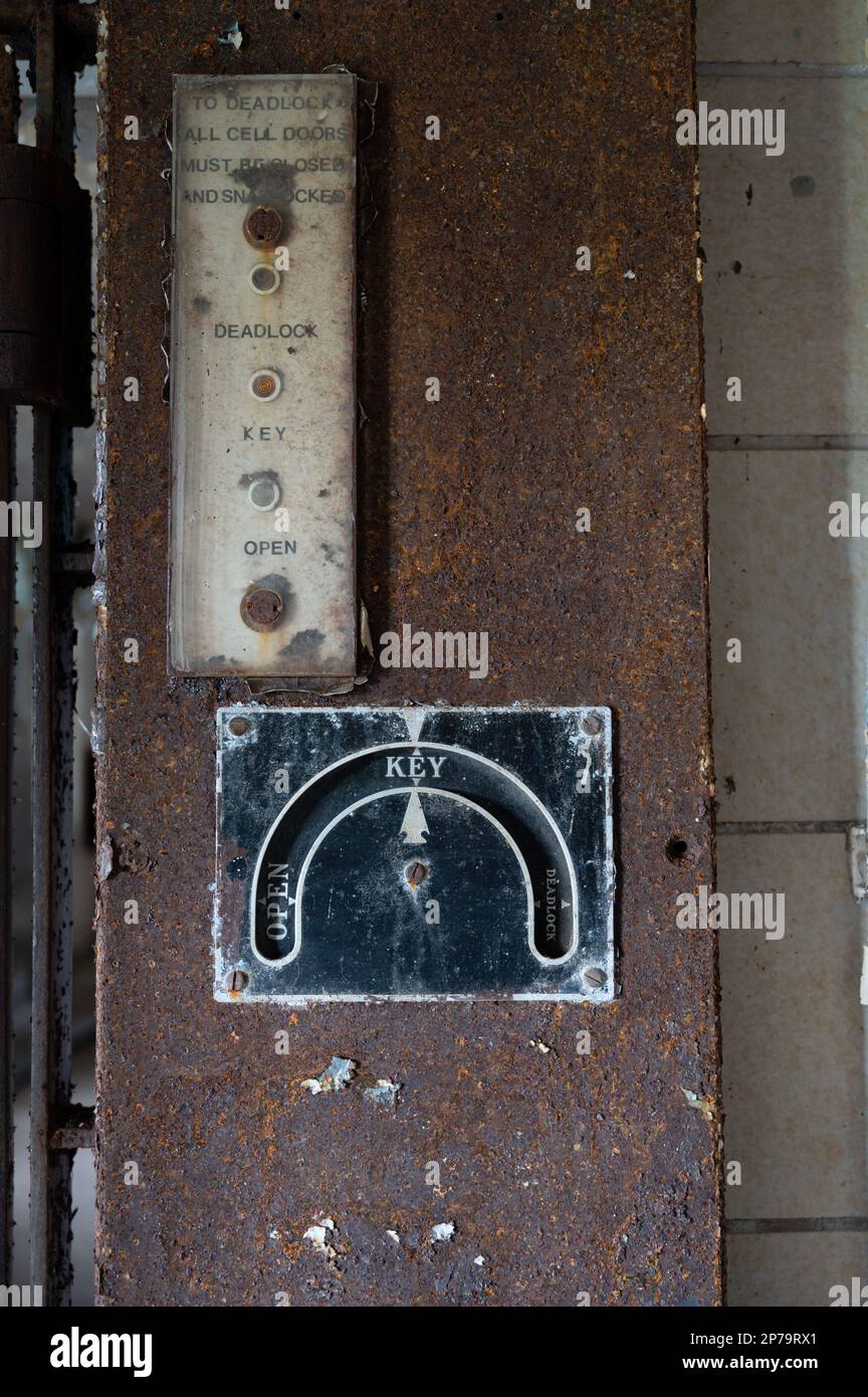 A close-up of an old electric meter in a dilapidated interior with ...