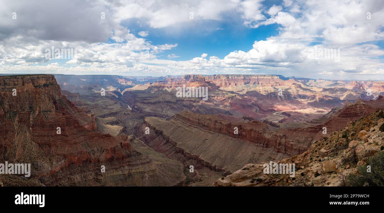 A scenic view of the Grand Canyon with a wide ravine and towering ...