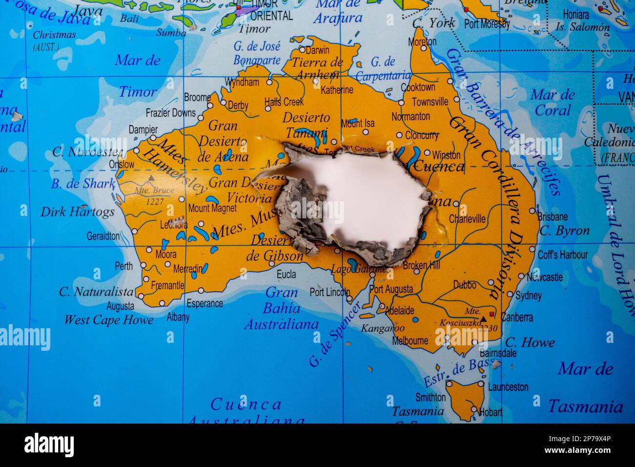 Close-up of a burned map of australia with ash residue in the copy ...