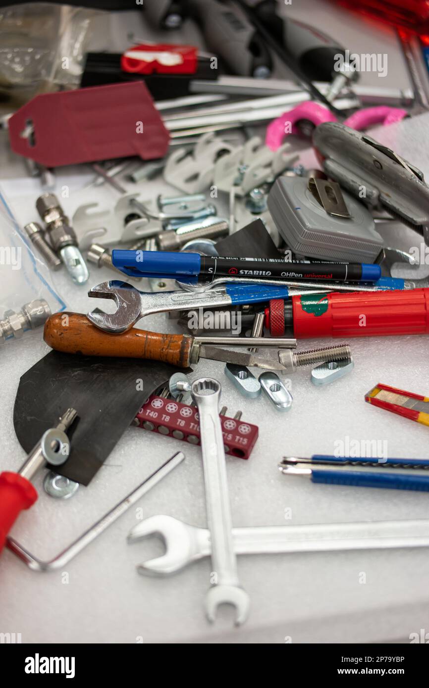 Messy tool desk top view scattered and unorganized work tools no people ...