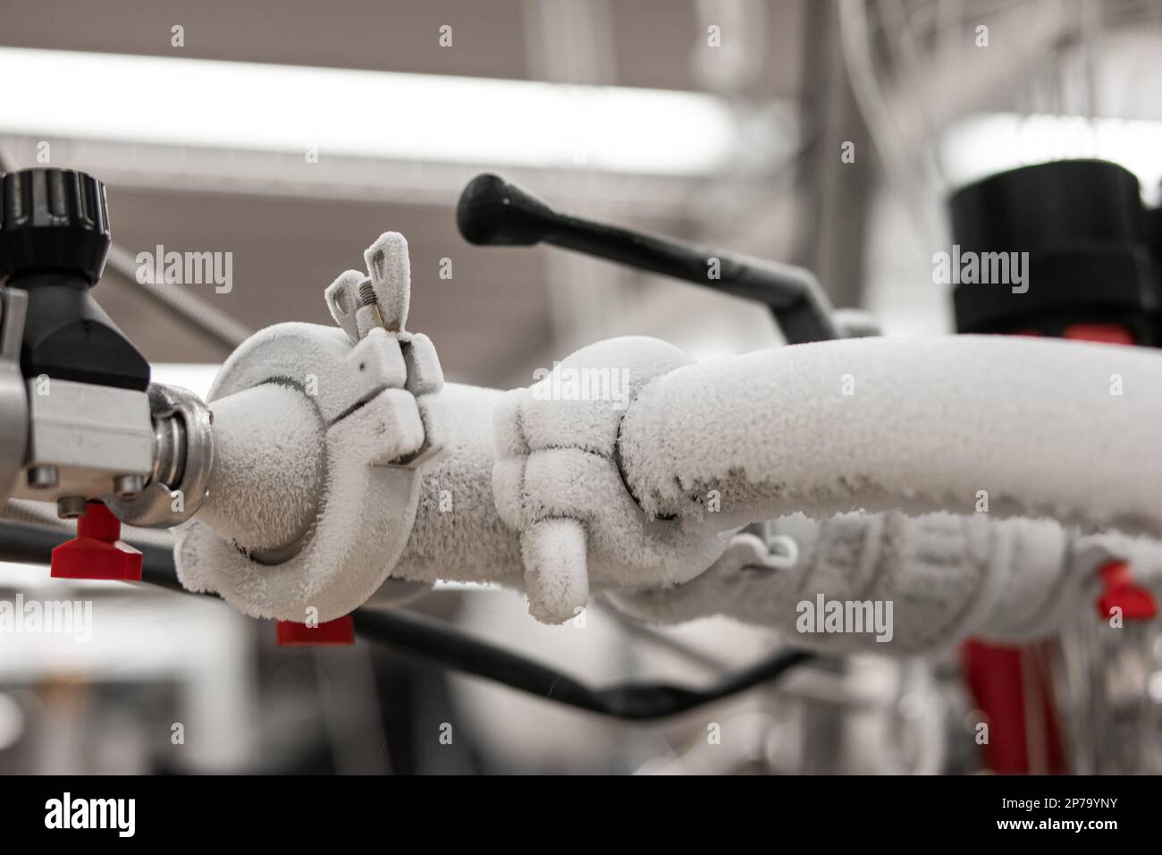 Liquid nitrogen frozen faucet lever and metal piping in a science ...