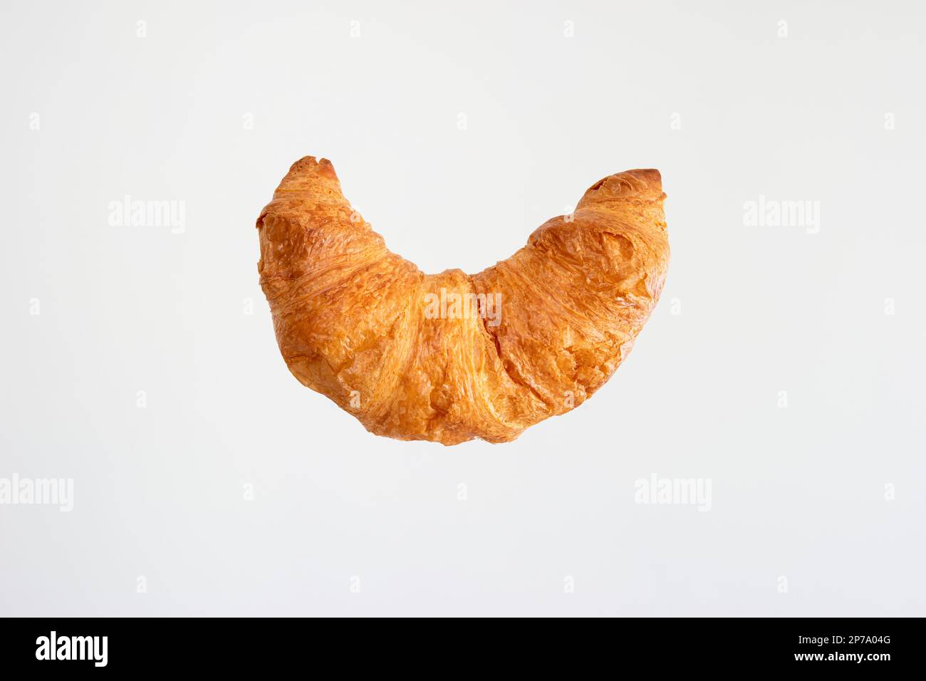 Single fresh butter croissant close up macro studio shot isolated on ...