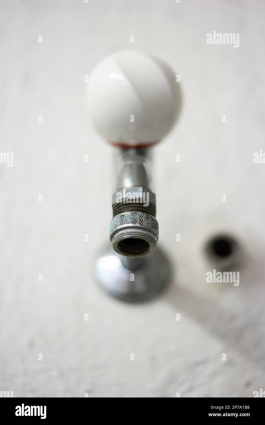 Old fashioned metal and white ebonite wall mounted tap water faucet ...