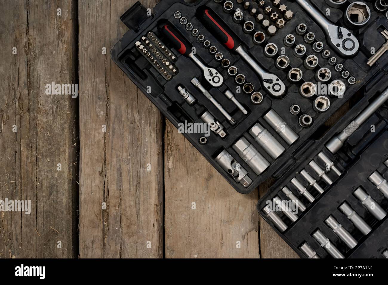Tool box detail. Wooden background. Wrenches and bits Stock Photo - Alamy