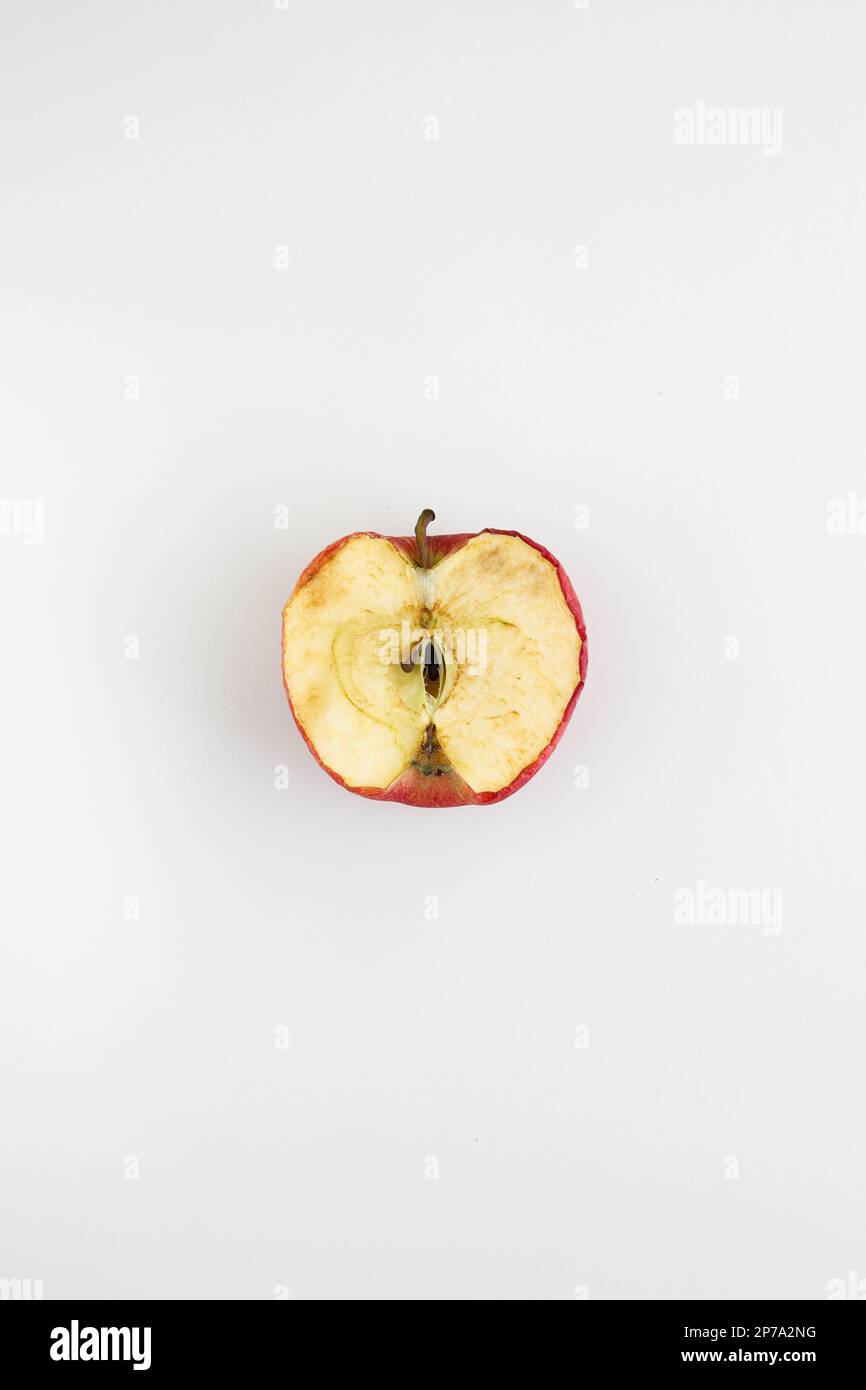 Halved spoiled rotting apple top view studio shot isolated on white ...