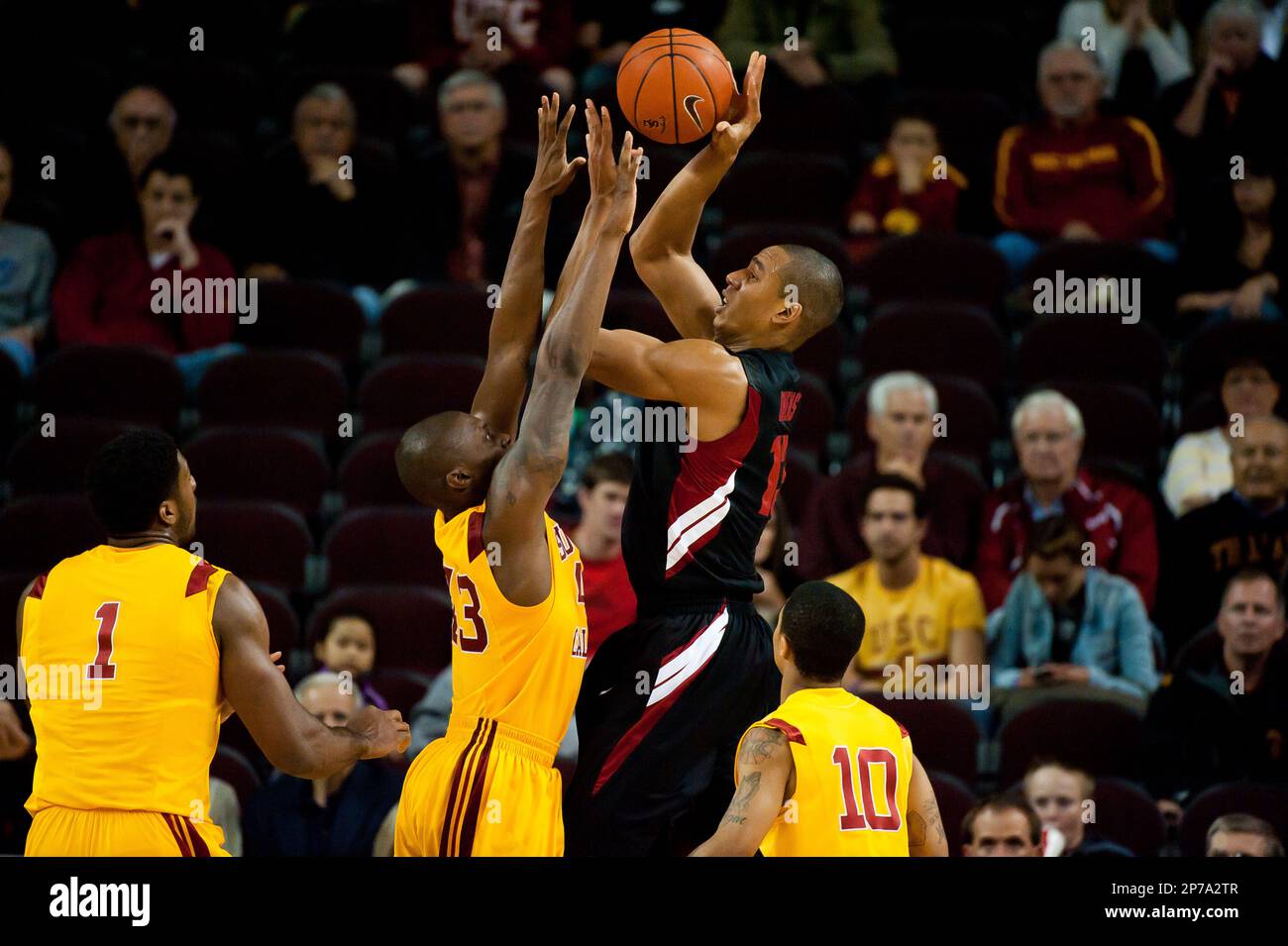 Southern California guard Marcus Simmons (43) blocks a shot by forward ...