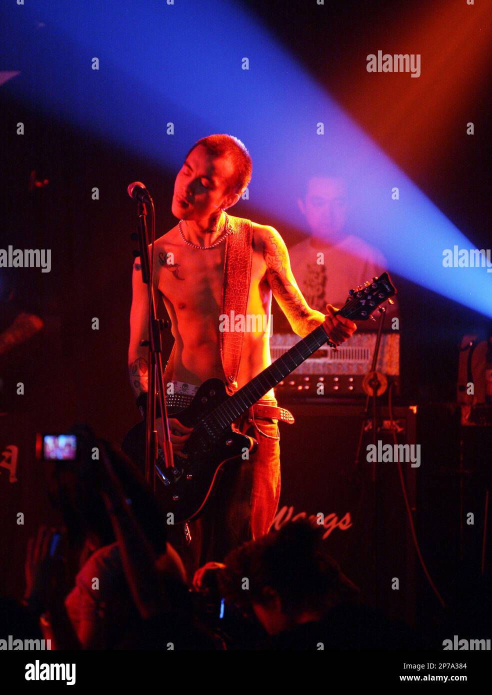 Huang Tao of Chinese metalcore band Yaksa plays guitar during an event ...
