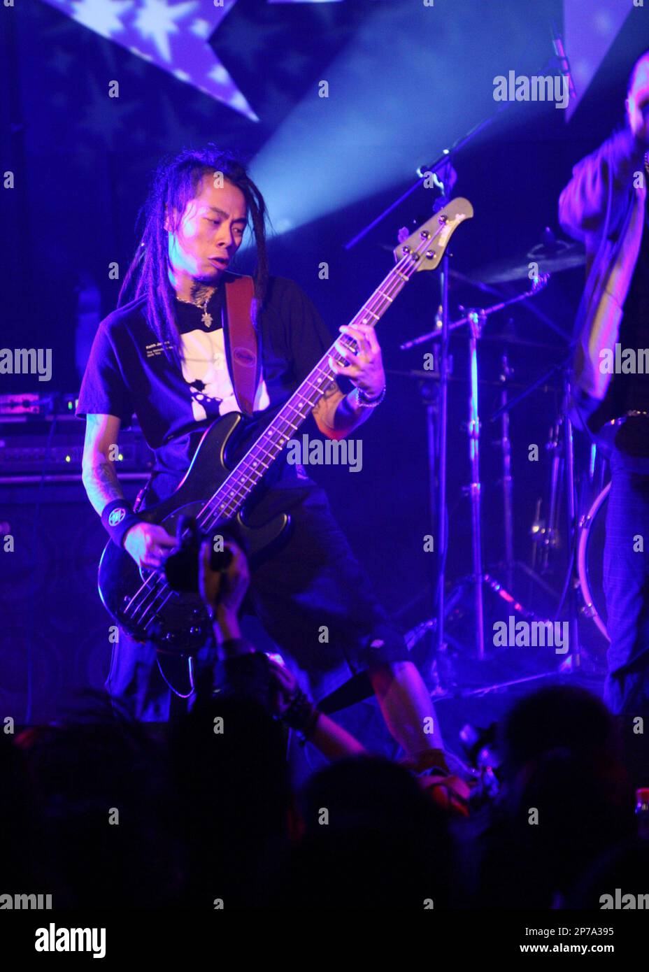 Han Tian of Chinese metalcore band Yaksa plays bass during an event to ...