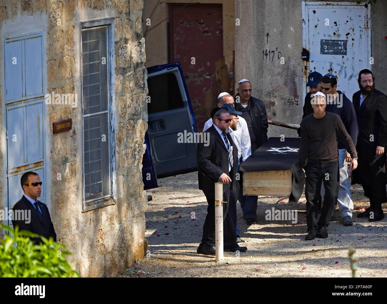 Pallbearers carry the coffin of Sonya Peres, the wife of Israeli President Shimon Peres, during ...