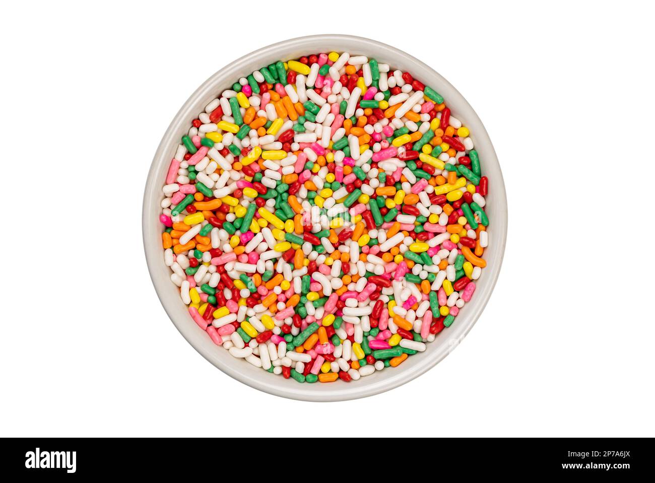 Top view of multicolored rainbow sugar sprinkles in white ceramic cup ...