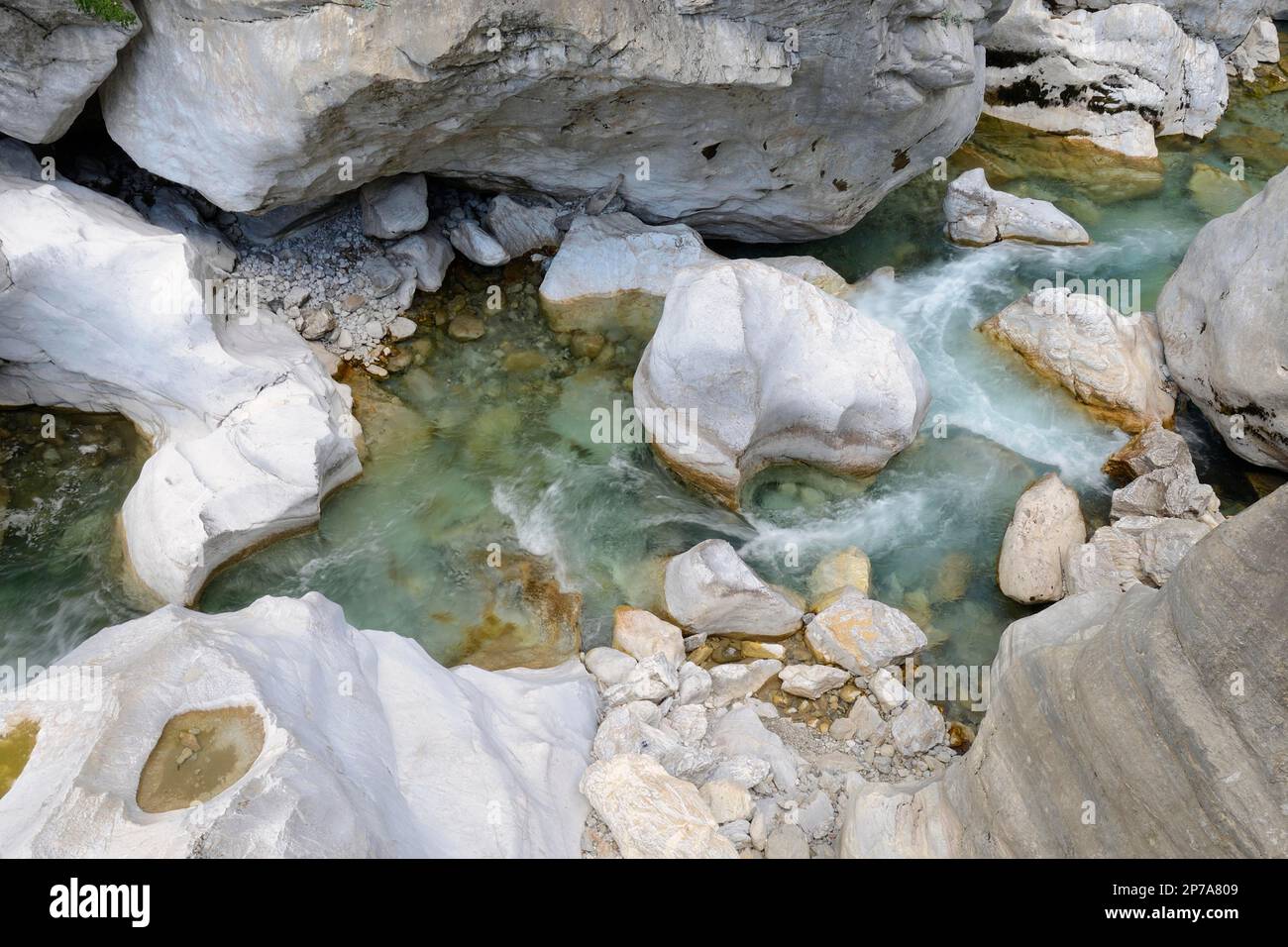 Crystal clear, clean water in the rocky riverbed of the Valbona ...
