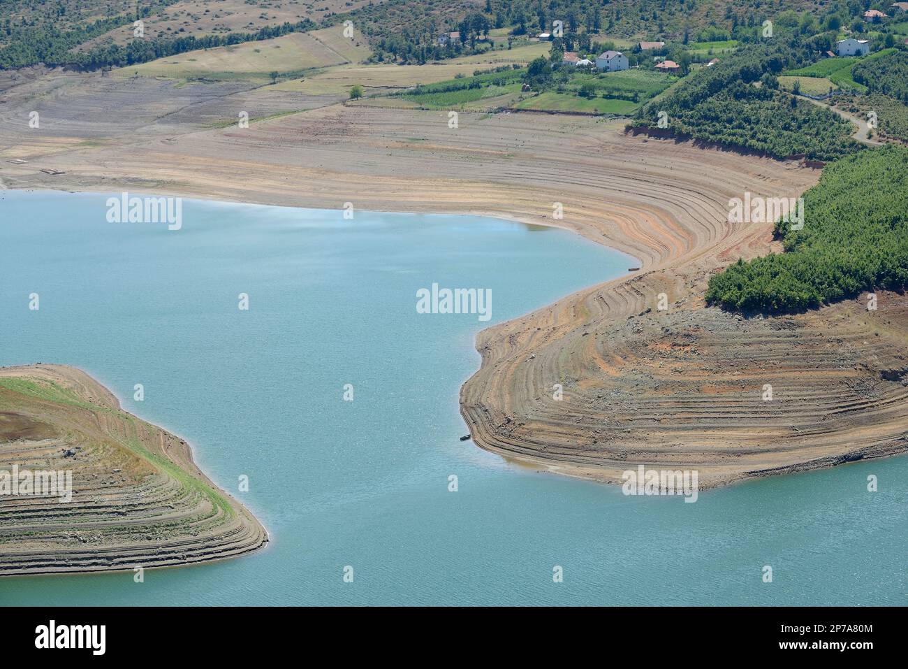 Little water in the Fierza reservoir with dry shore, near Kukes ...