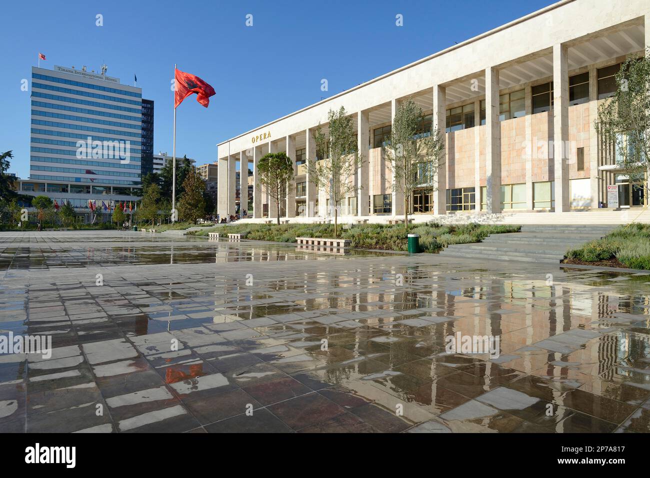 The Palace of Culture, Opera House, reflected in a puddle, Skanderbeg ...
