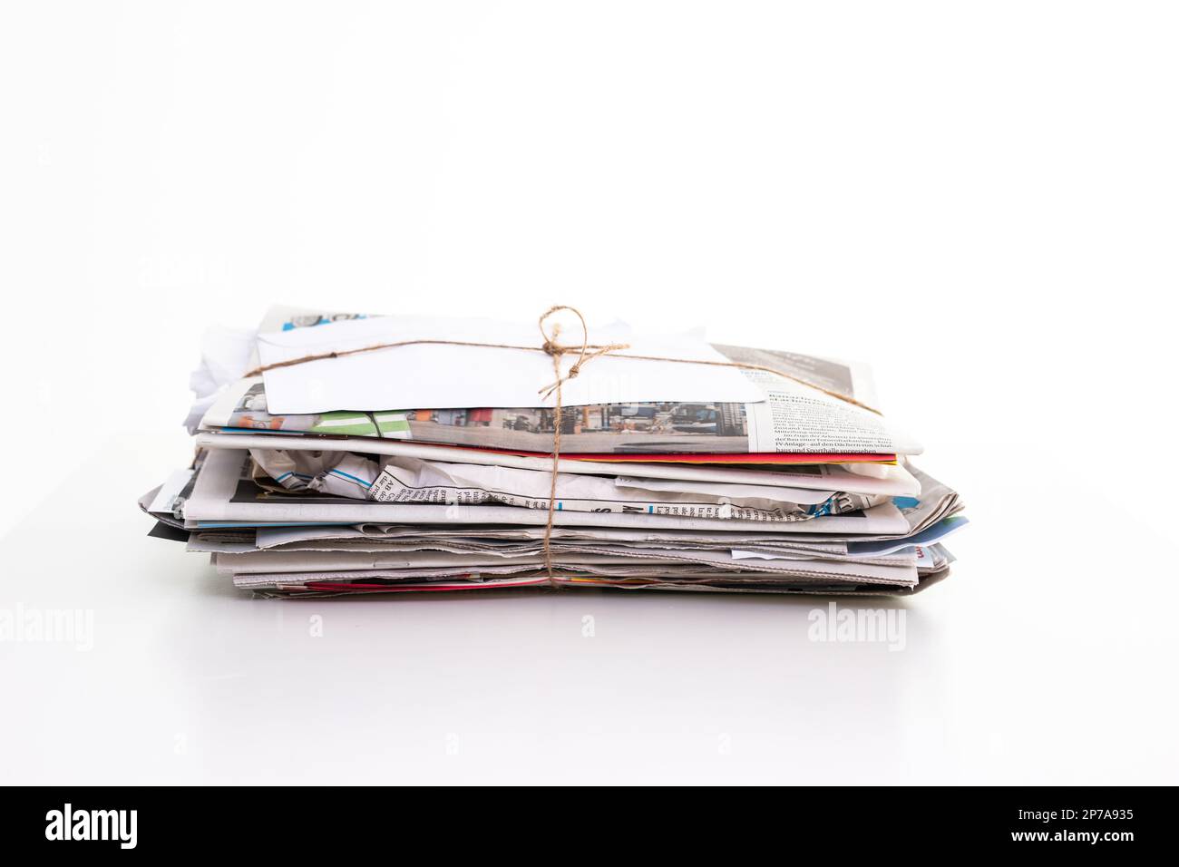 Stacked pressed and packaged household paper trash ready to be picked ...