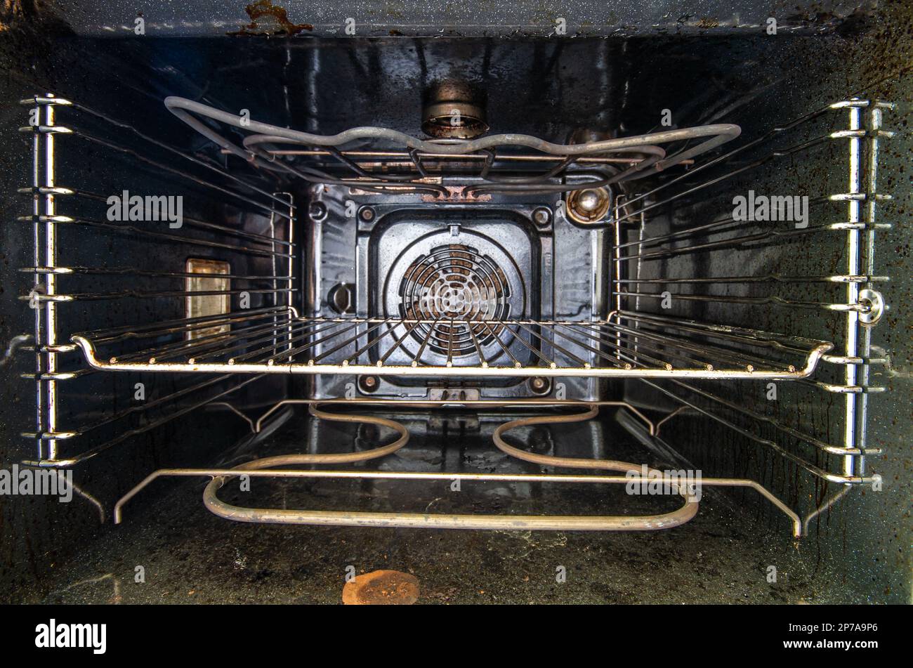 Dirty open household oven inside view close up wide shot no people ...