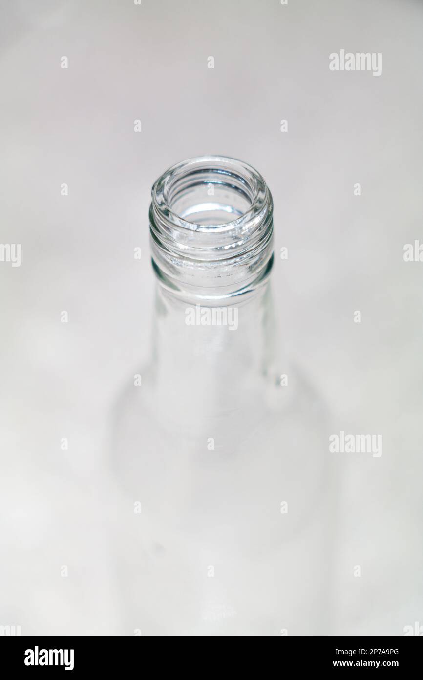 Clear empty glass bottle neck close up shot shallow depth of field top ...