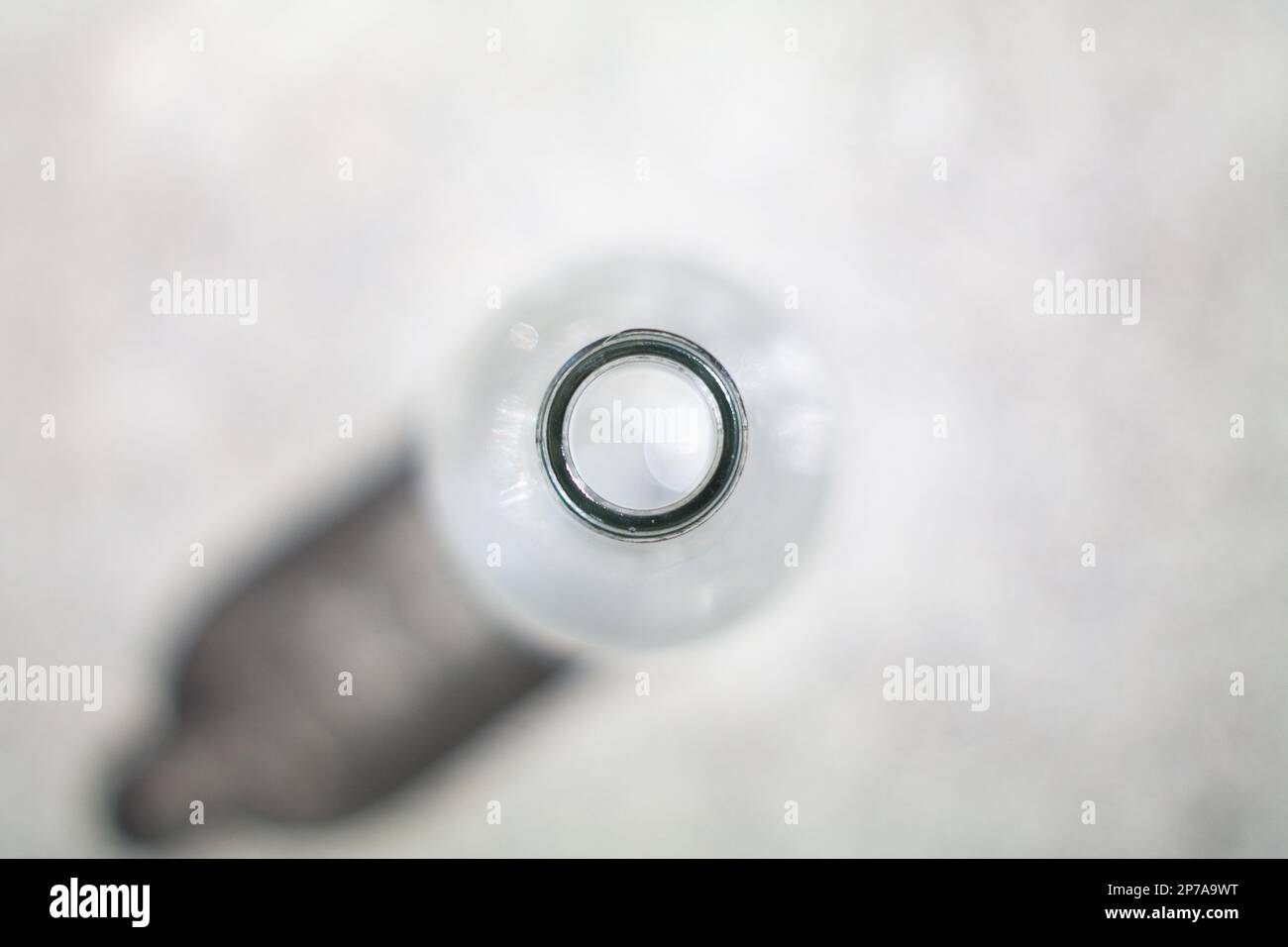 Clear empty glass bottle neck close up shot shallow depth of field top ...