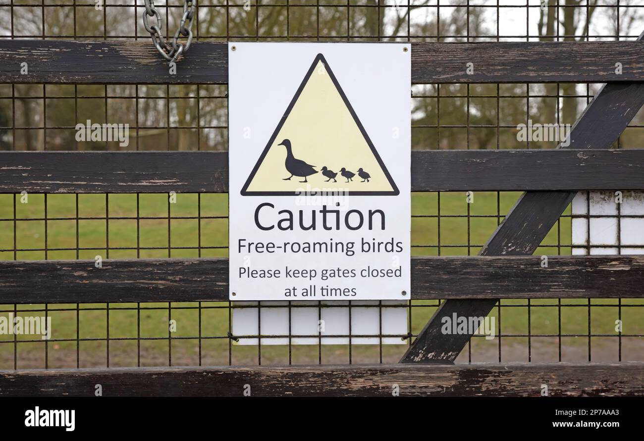 Sign on a gate: Caution, free-roaming birds, please keep gates closed ...