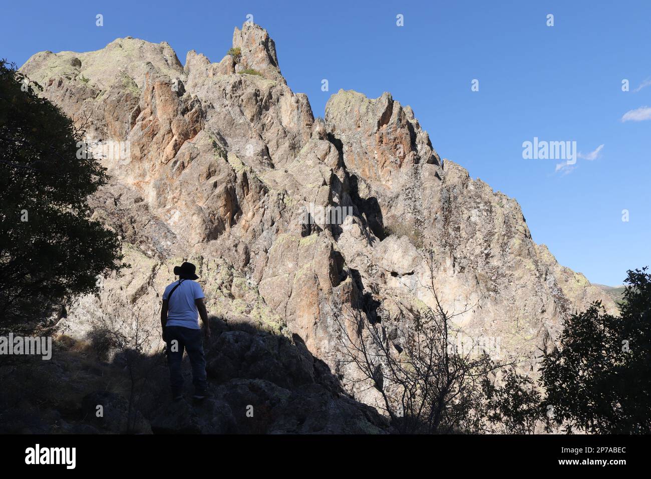 A man stops to enjoy the view while hiking Stock Photo - Alamy