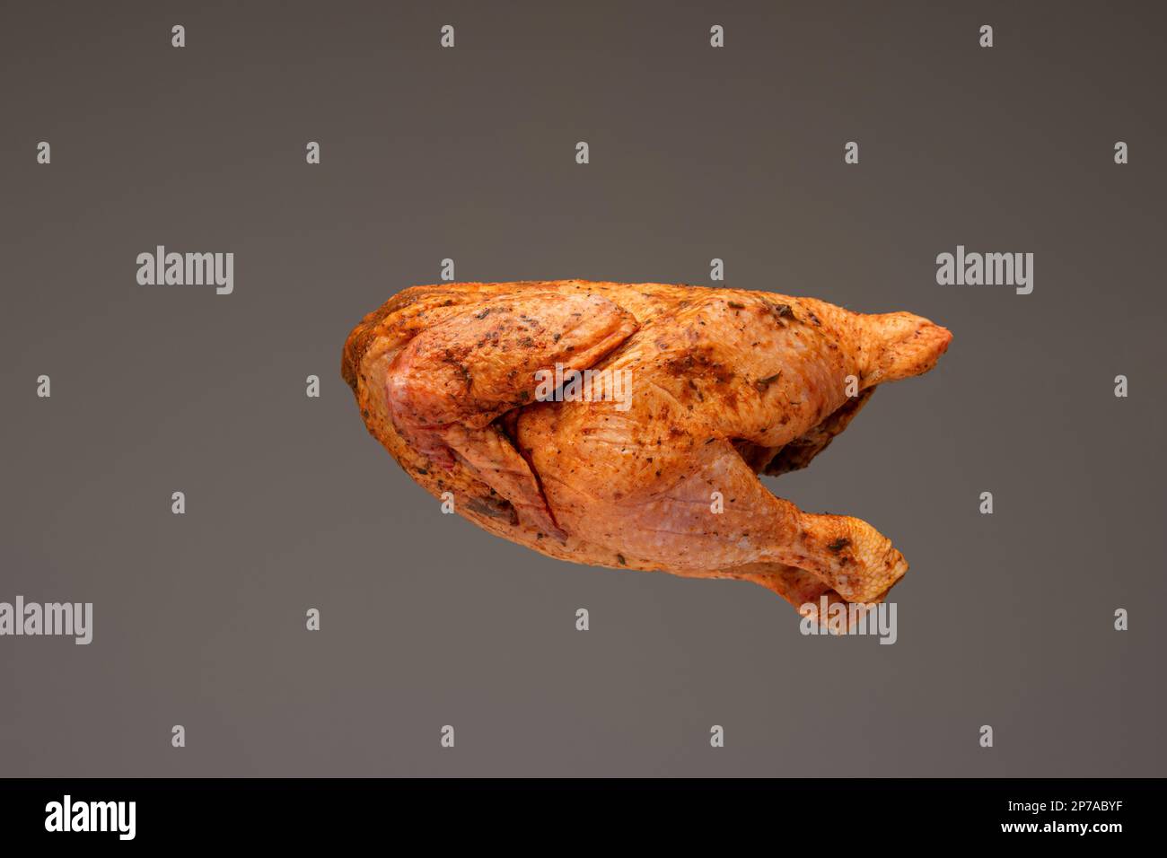 Fresh whole chicken, raw and ready seasoned. Close up studio shot ...