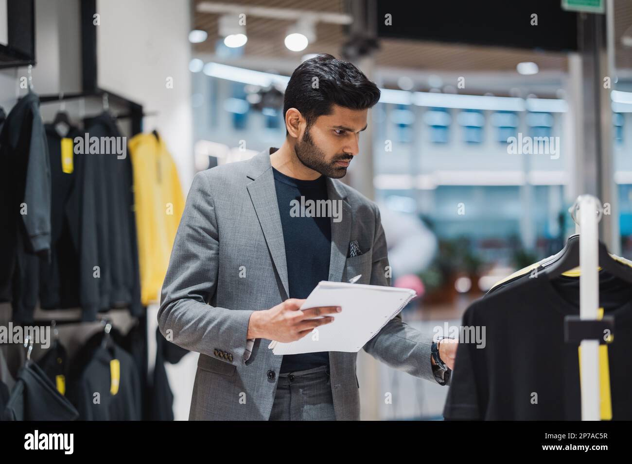Male asian client clothing store hi-res stock photography and images ...