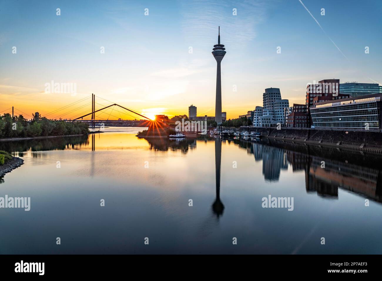 Media harbour at sunrise with view of Rhine tower and Rhine knee bridge ...