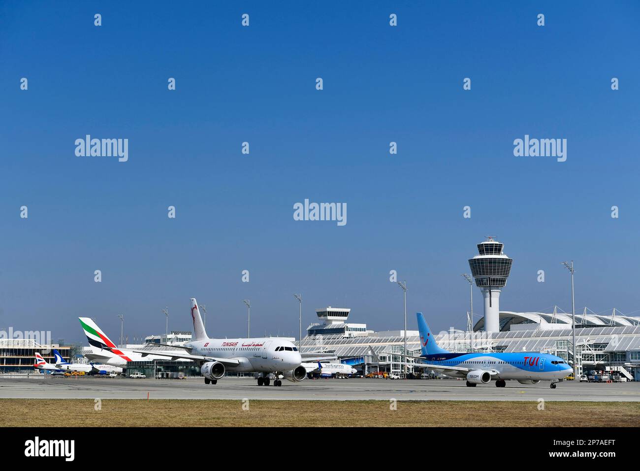 Tunisair Airbus 319 with TUIfly Boeing B737-85 (WL) taxiing in front of ...