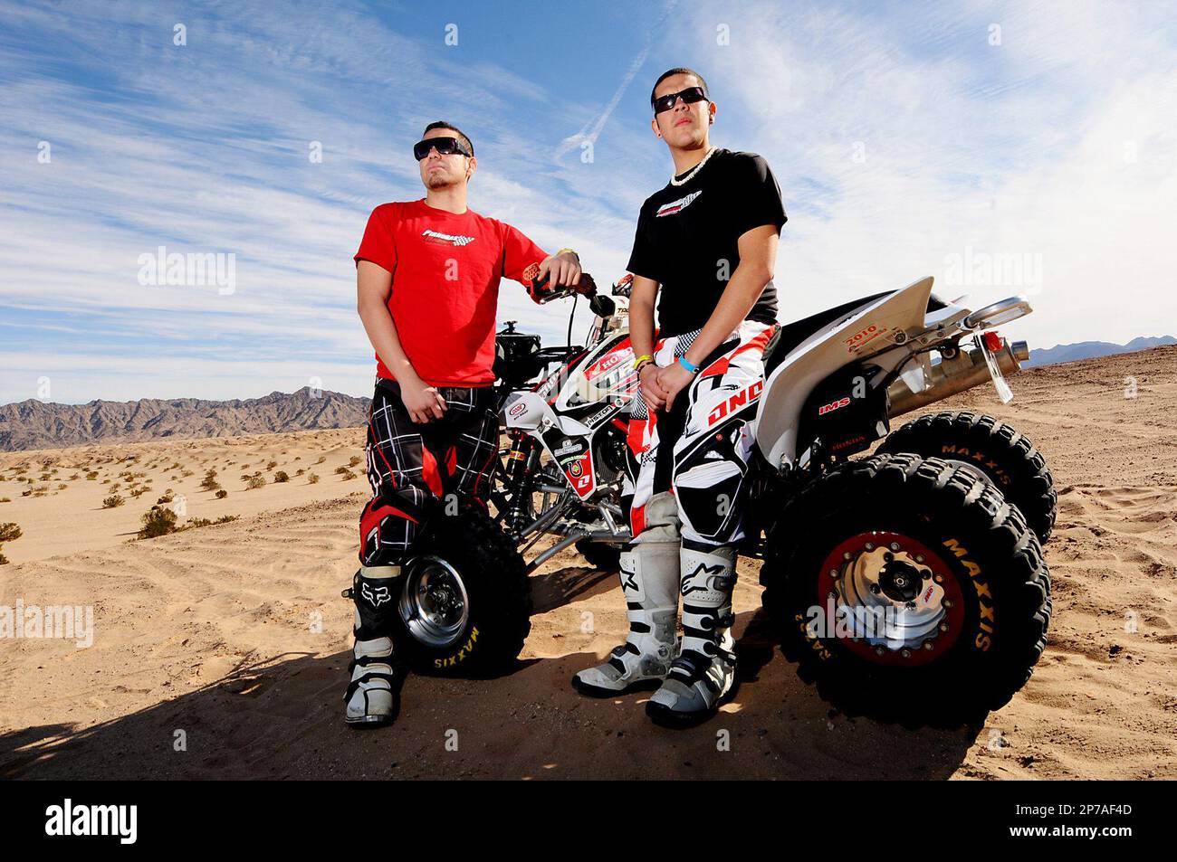Brothers Alonzo and Juan Dominguez sit on an ATV outside Yuma, Ariz. on ...