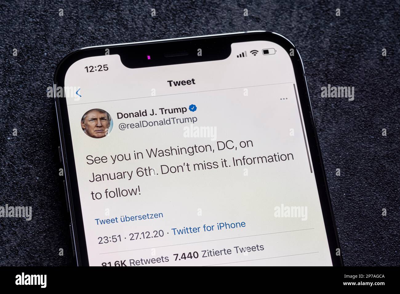 Smartphone with a Twitter tweet from Donald Trump with a message about ...