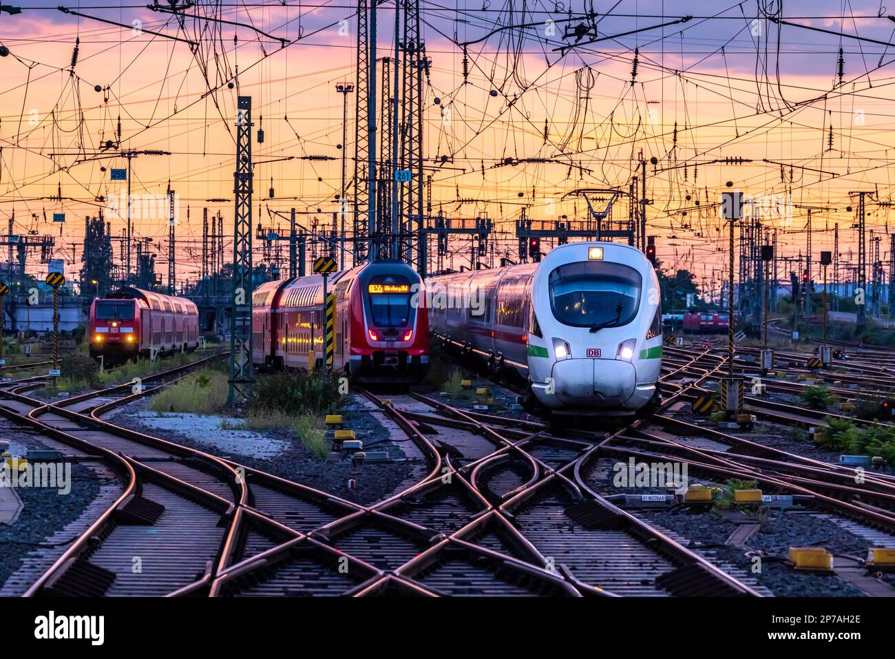 Main station in the evening glow, track apron with Deutsche Bahn ICE ...