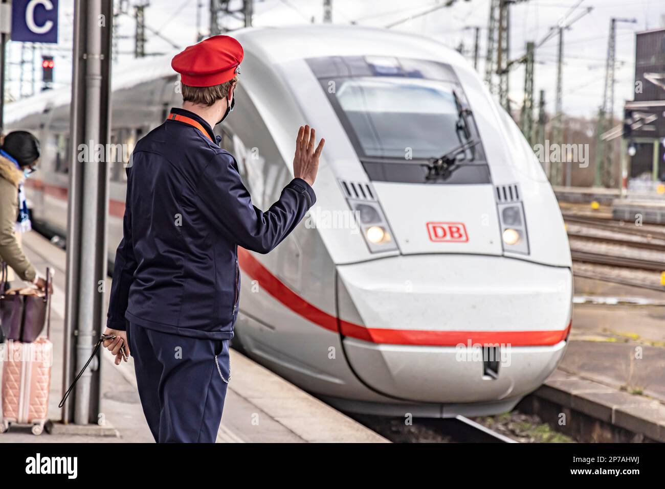 Arriving InterCityExpress ICE with uniformed Deutsche Bahn employee ...