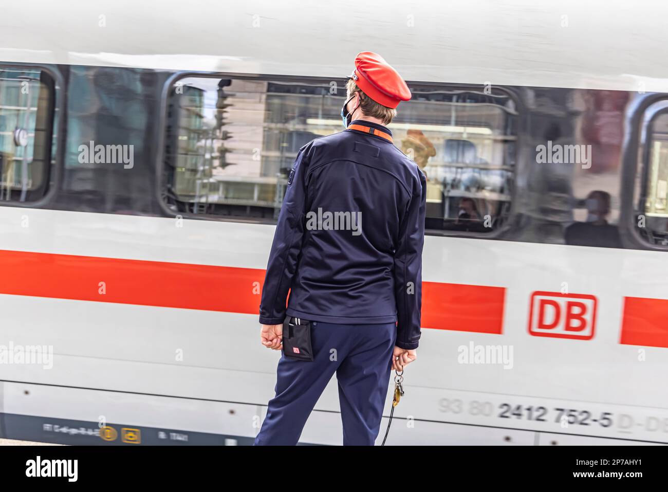 Arriving InterCityExpress ICE with uniformed Deutsche Bahn employee ...