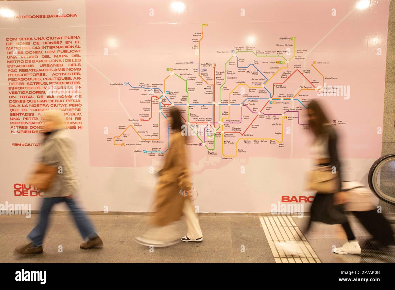 Women walk past the symbolic map during the presentation of the ...