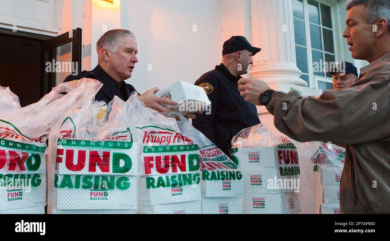 In a Dec. 18, 2010 photo Rainier Police Chief Ralph Painter helps fill ...